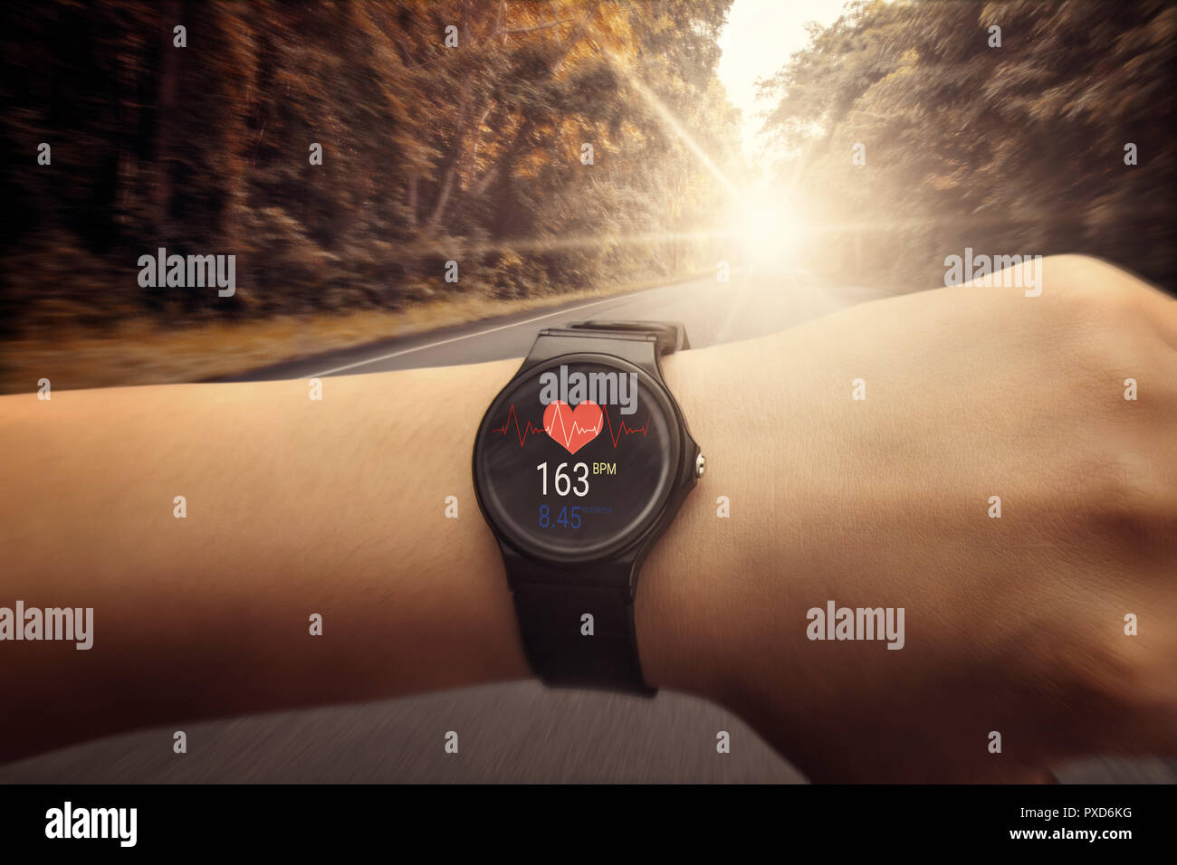 Female marathon runner checking smart watch hi-res stock photography ...