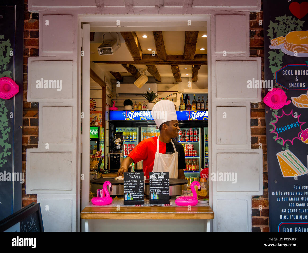Paris, France - August 12, 2018 : Chef at take away counter serving ...