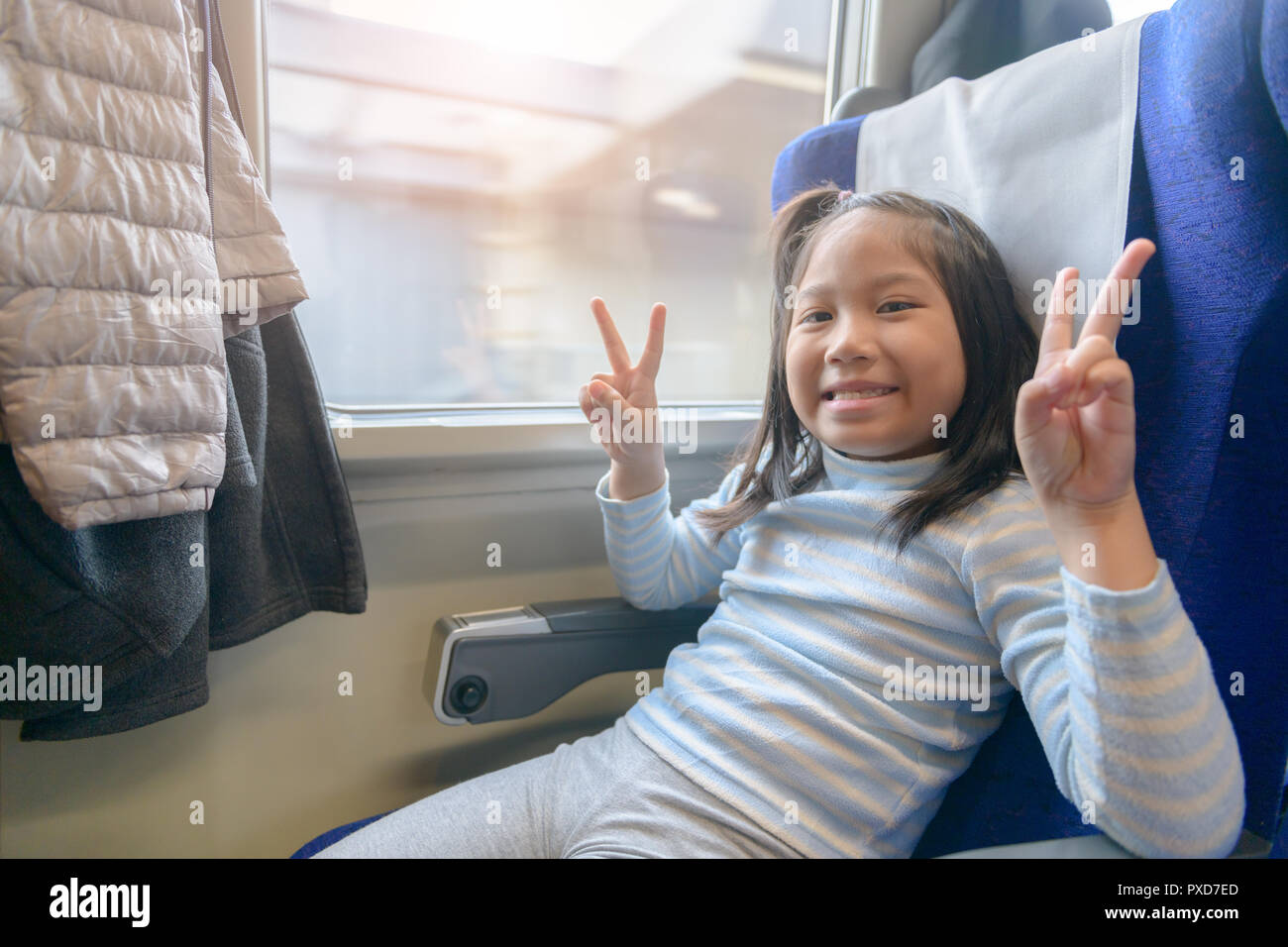Little girl traveler smile and sit in the train in japan, travel ...