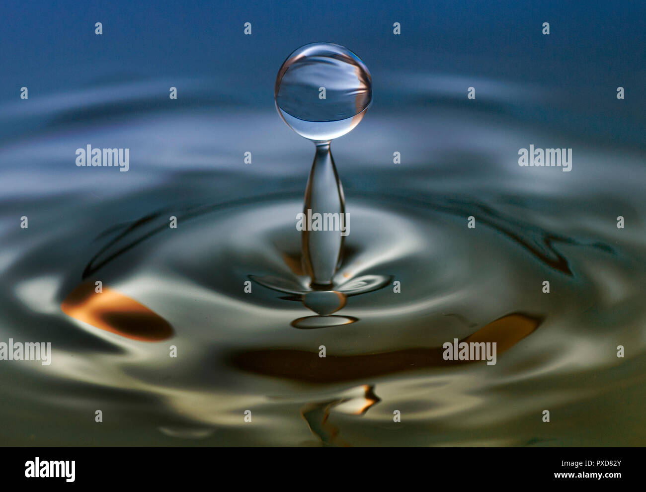 Water Droplet Splashing In A Glass Stock Photo - Alamy