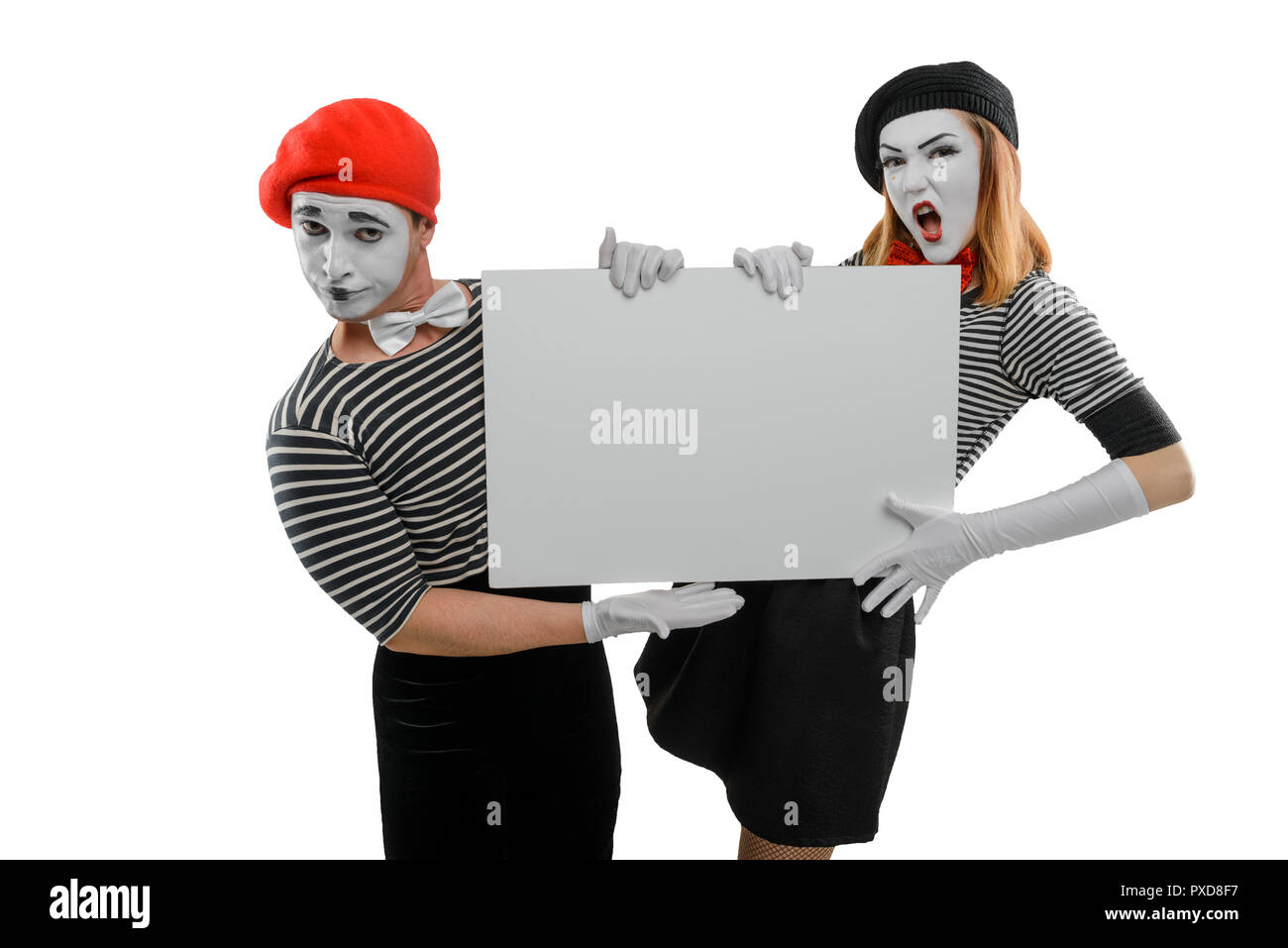 Two mimes holding big board Stock Photo - Alamy