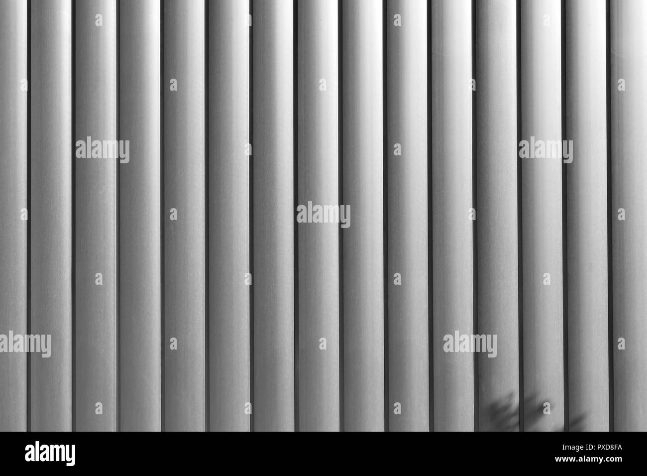 exterior wall made with vertical aluminum strips, lighting with shades ...