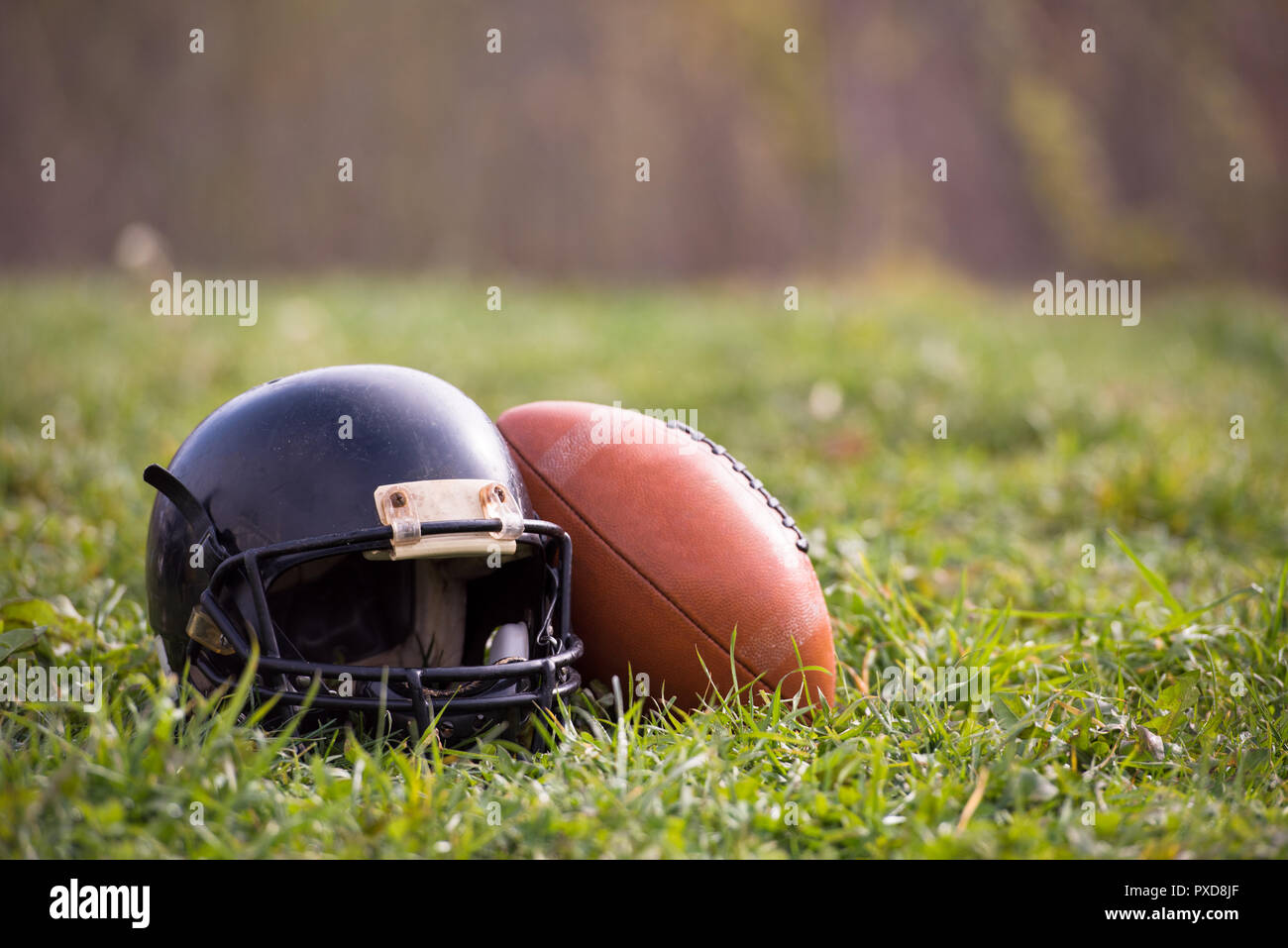 American football helmet lying hi-res stock photography and images - Alamy