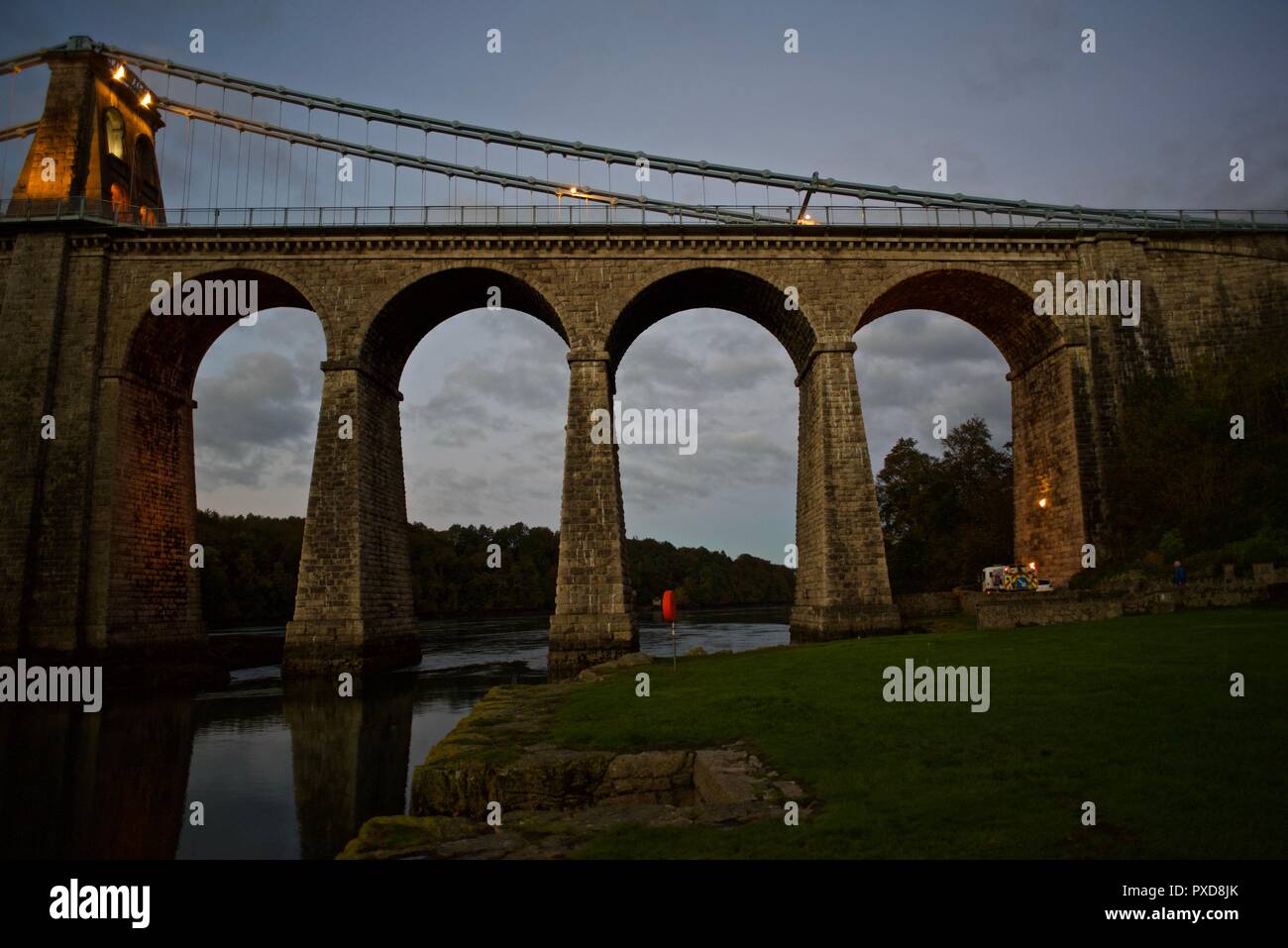 Limestone columns and arches of the Menai Suspension Bridge at dawn ...