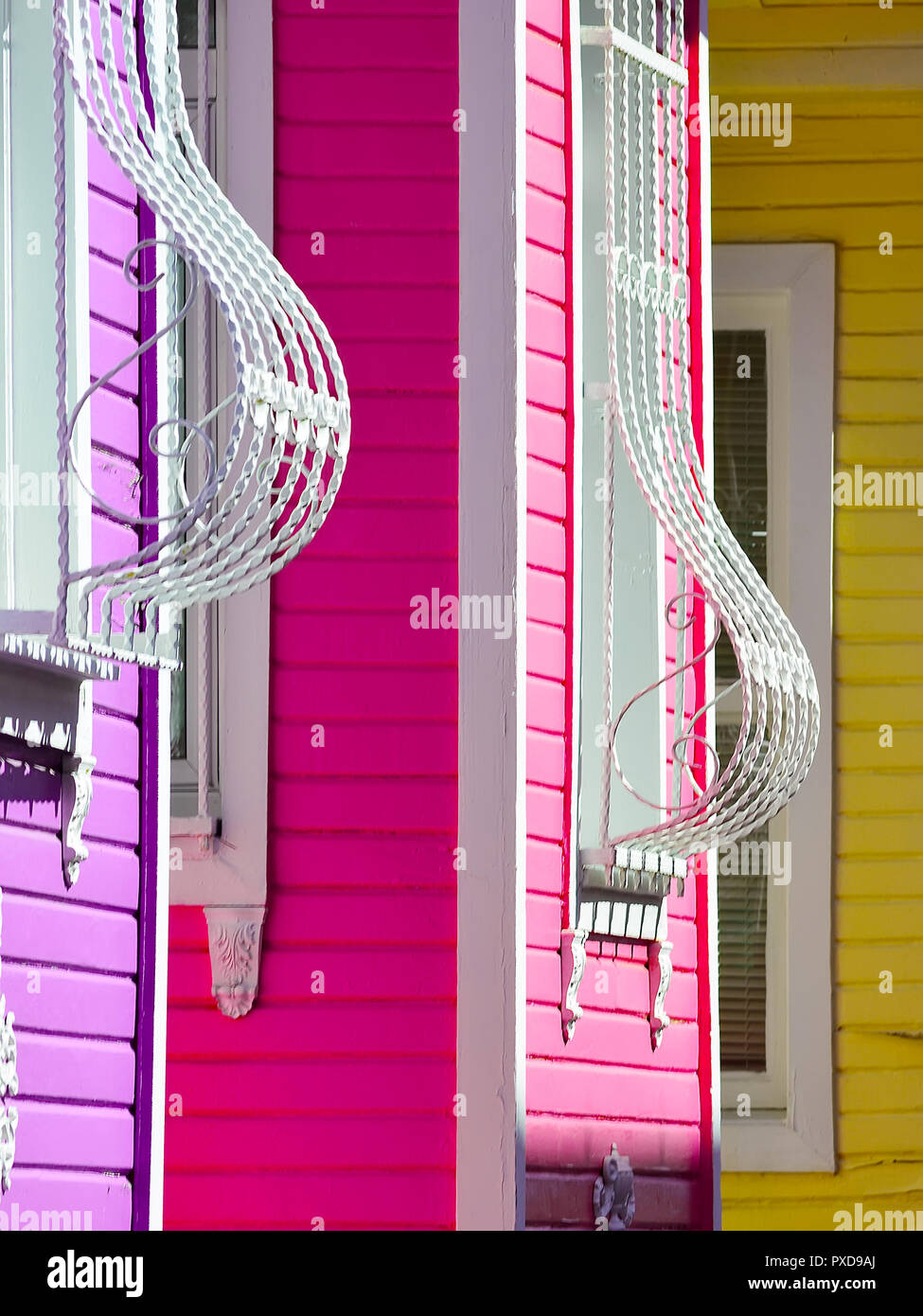 Fragment of a multicolor facade of the house with curved bars on the ...