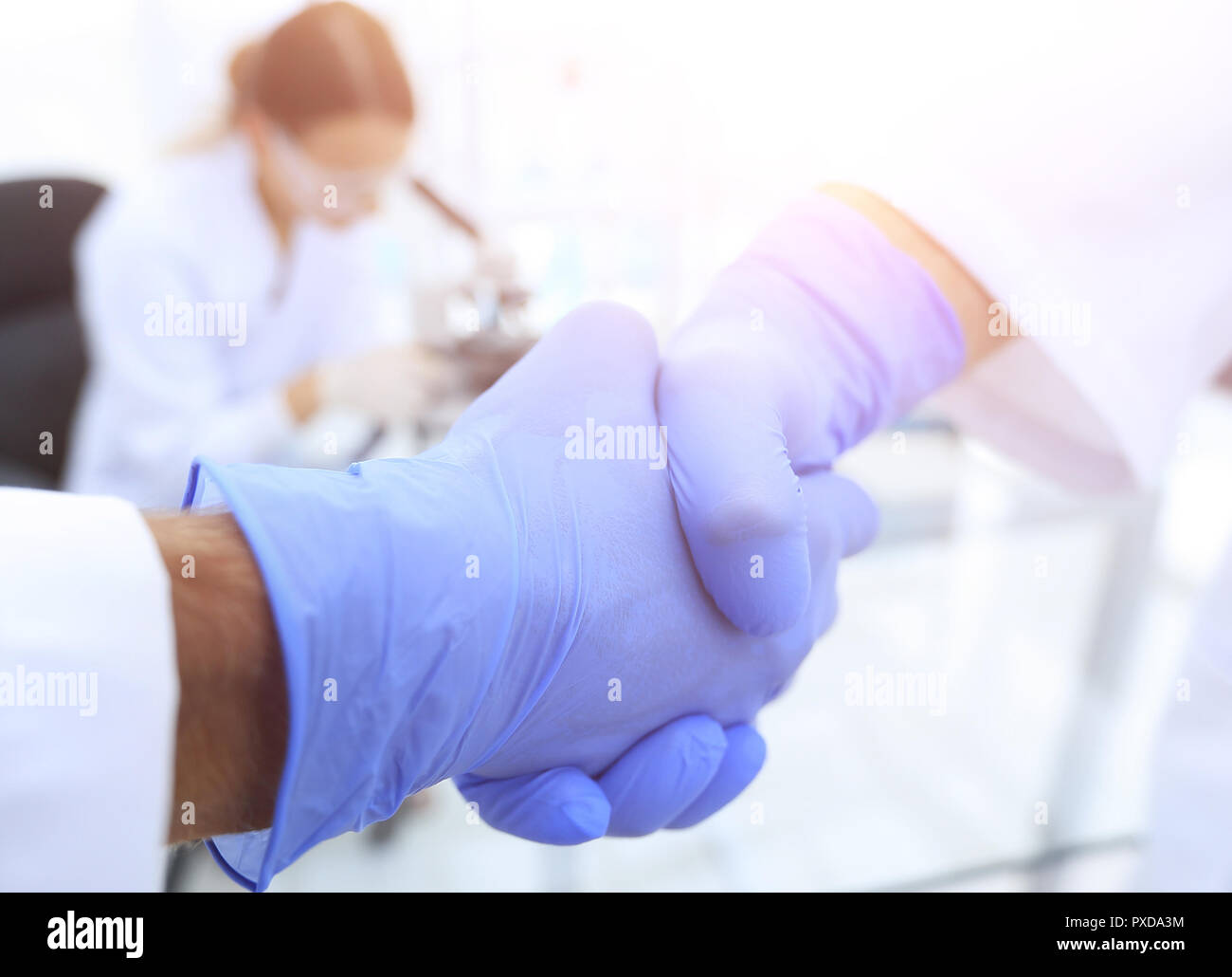 hand in the medical glove (handshake Stock Photo - Alamy