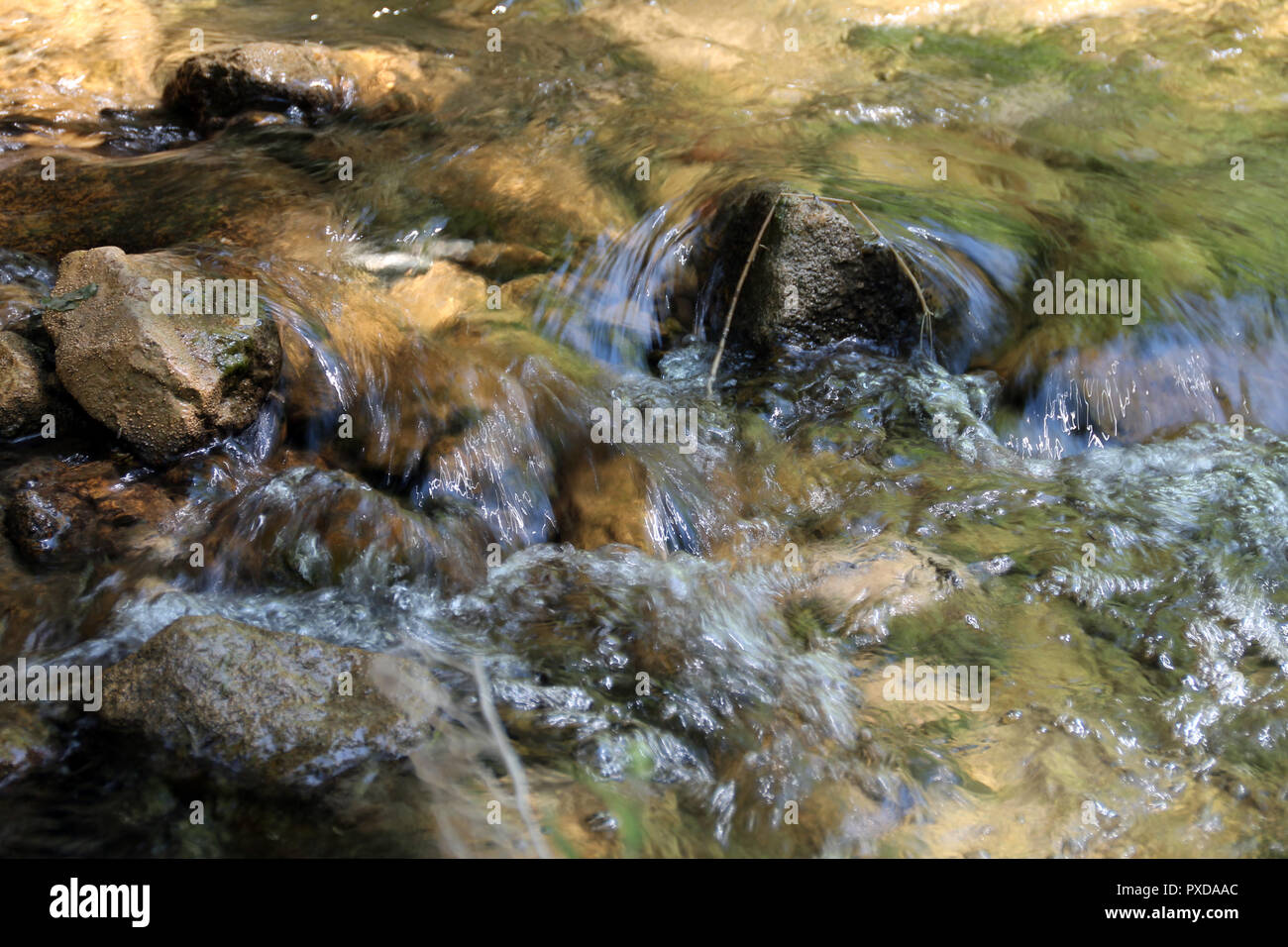 water running through a stream at high speed Stock Photo - Alamy
