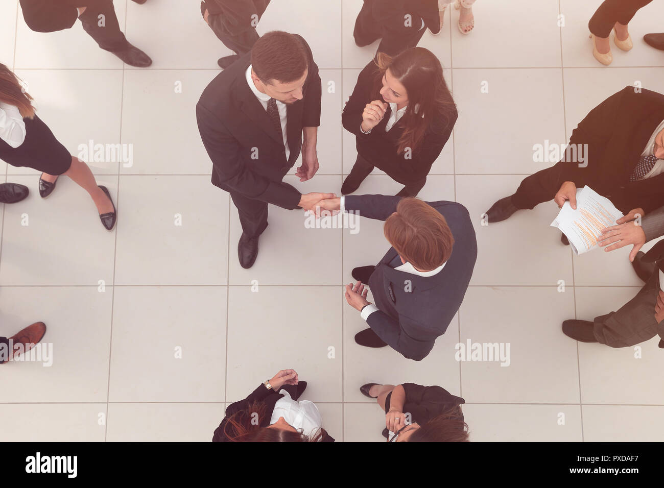 Handshake greeting between female male hi-res stock photography and ...