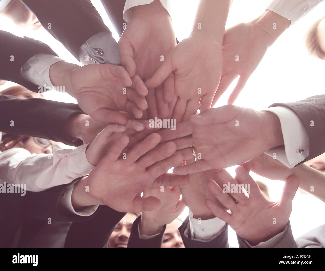 large business team is forming a circle and his hands clasped together ...