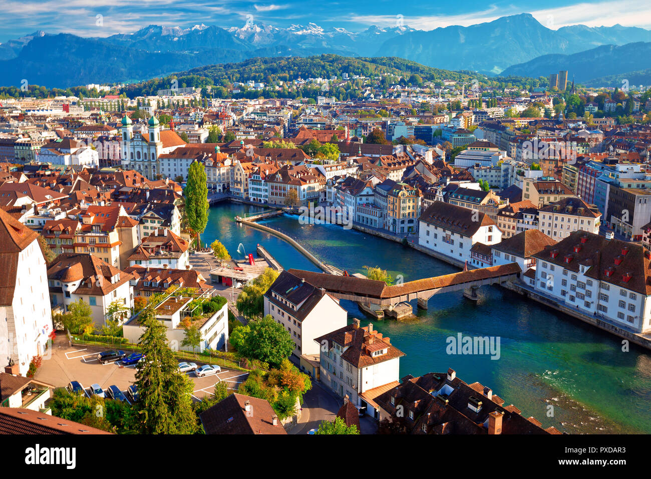 City of Luzern riverfront and rooftops aerial view, Alps landscape of ...