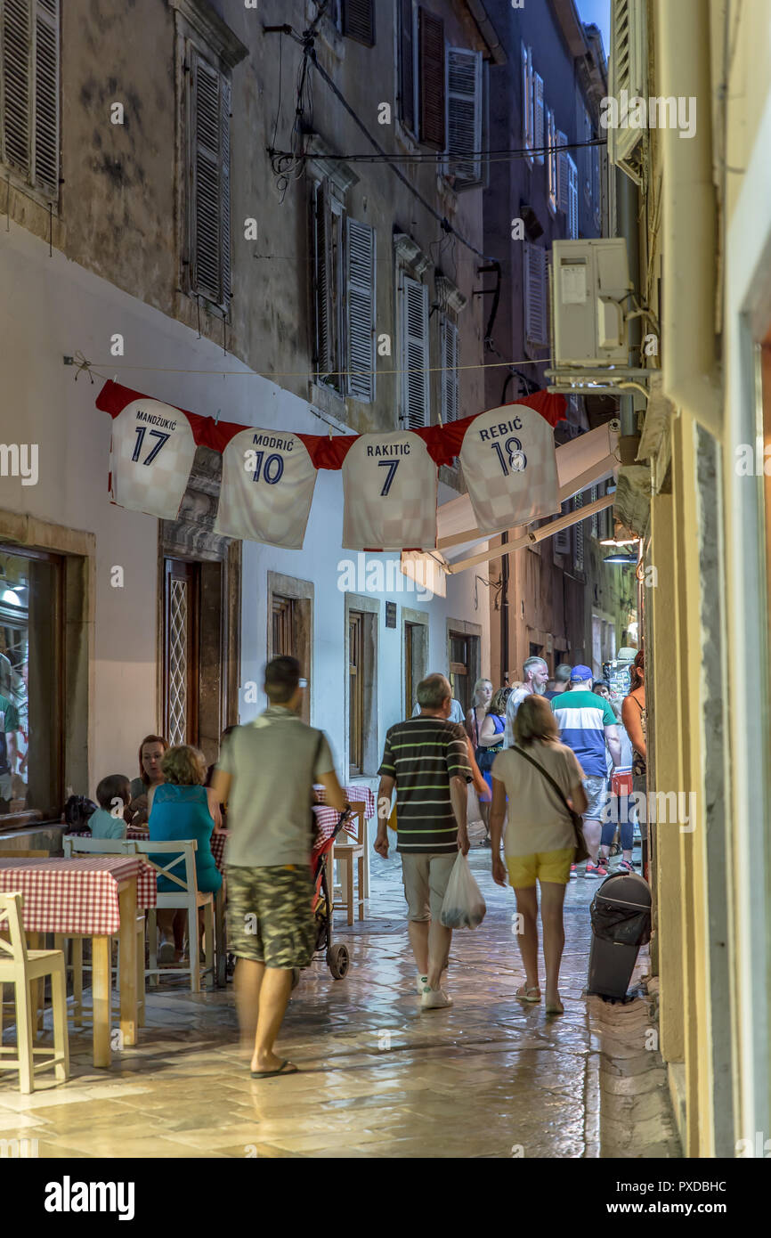 Croatian Football player team shirts hanging on lines above a street in ...
