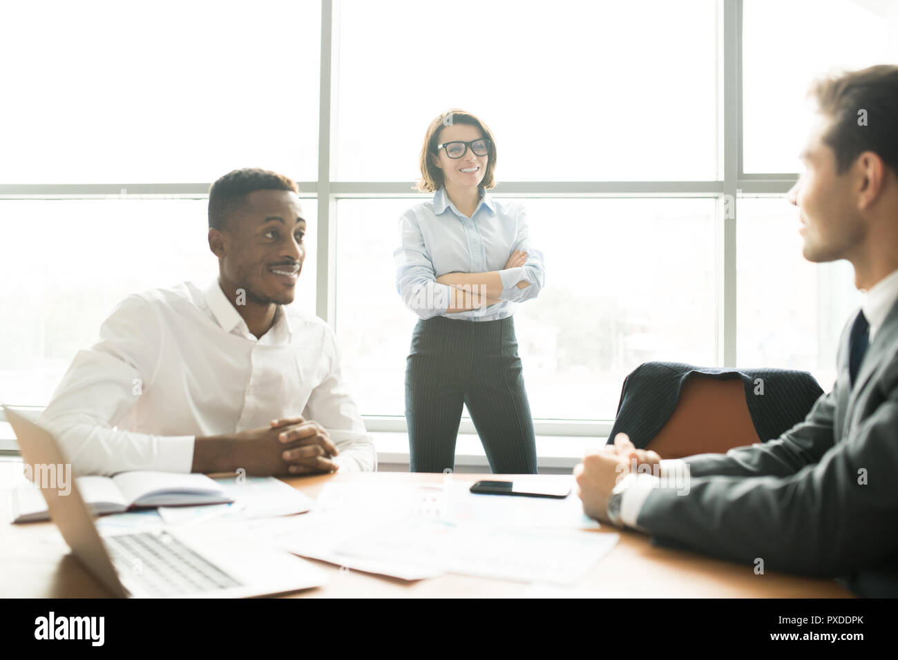 Modern multi-ethnic business experts discussing startup project Stock ...