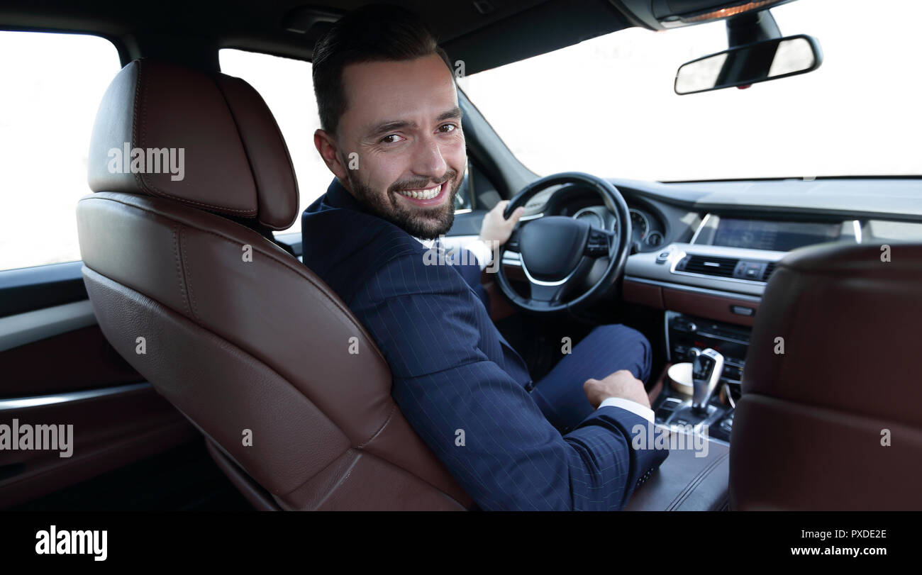Successful man sitting behind the wheel of a prestigious car Stock ...
