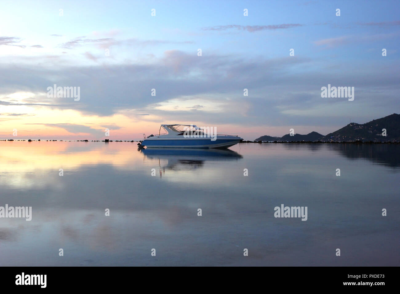 speed boat in the sea with beautiful sunrise background Stock Photo - Alamy