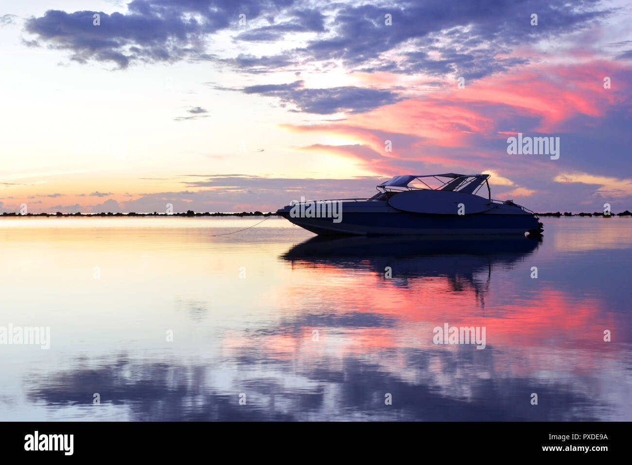 speed boat in the sea with beautiful sunrise background Stock Photo - Alamy