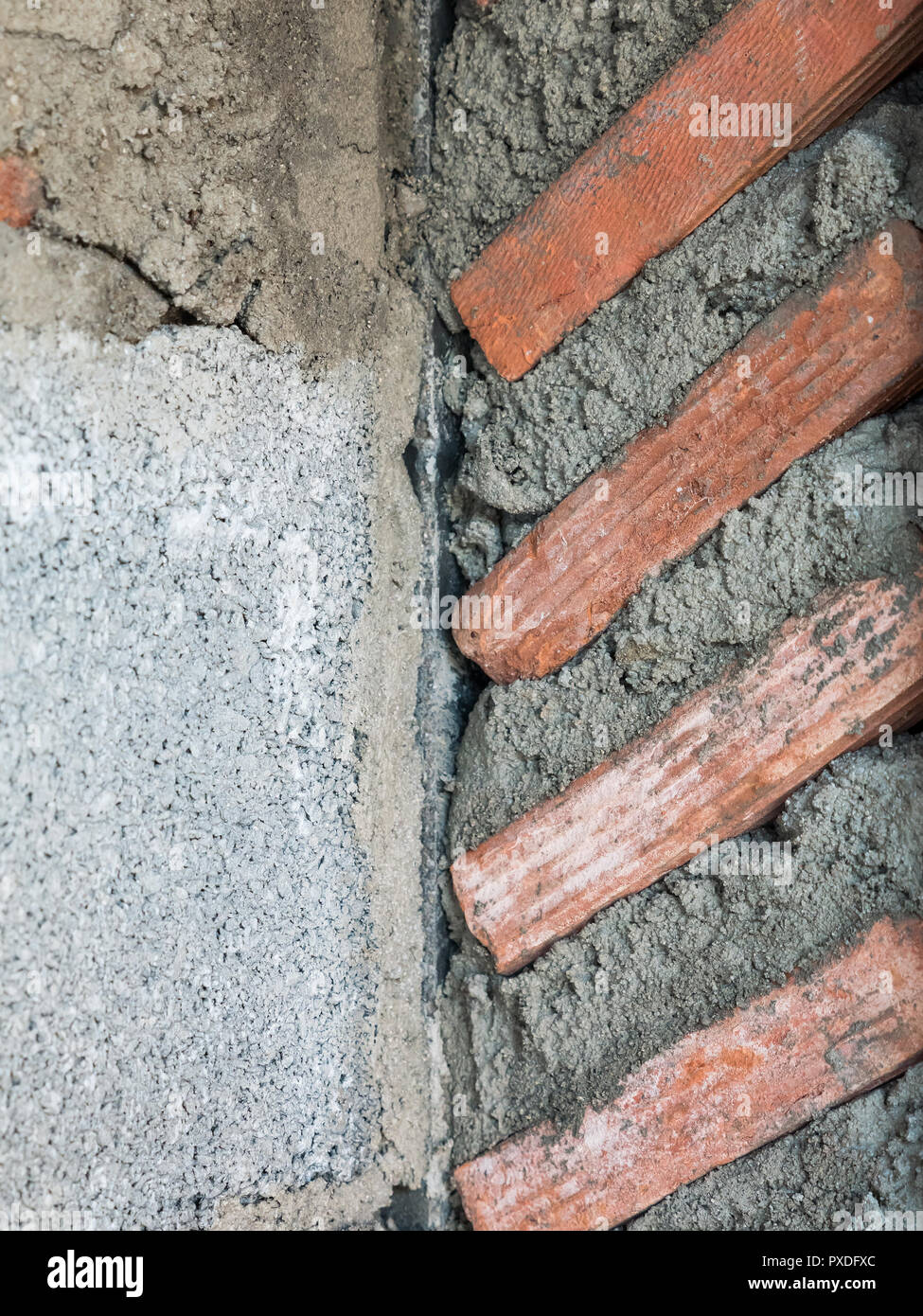 Closeup of the unfinished brick wall in the under construction of the ...