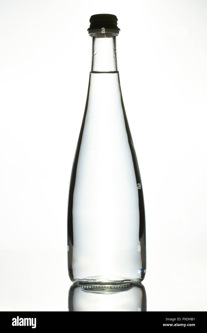 Glass bottle with a white transparent liquid Stock Photo - Alamy