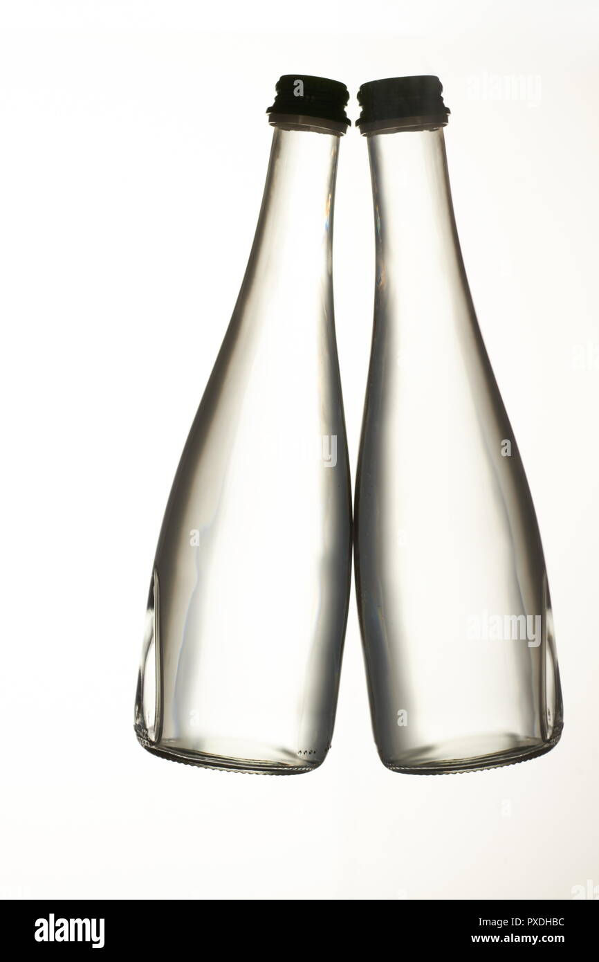 Two transparent glass bottles Stock Photo - Alamy