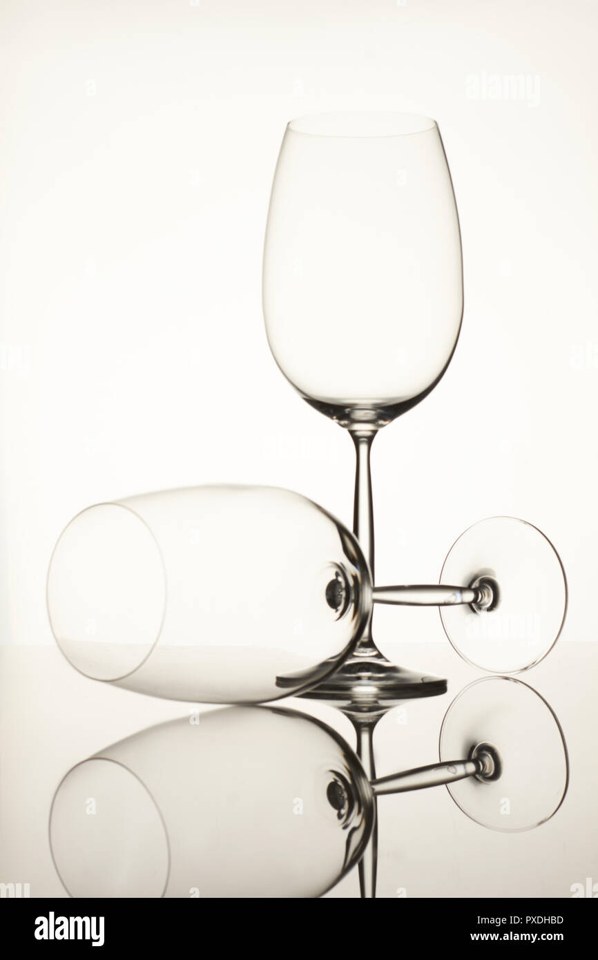 Empty wine glasses falling Stock Photo - Alamy