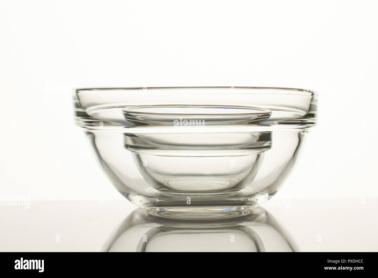 Empty glass bowls Stock Photo - Alamy