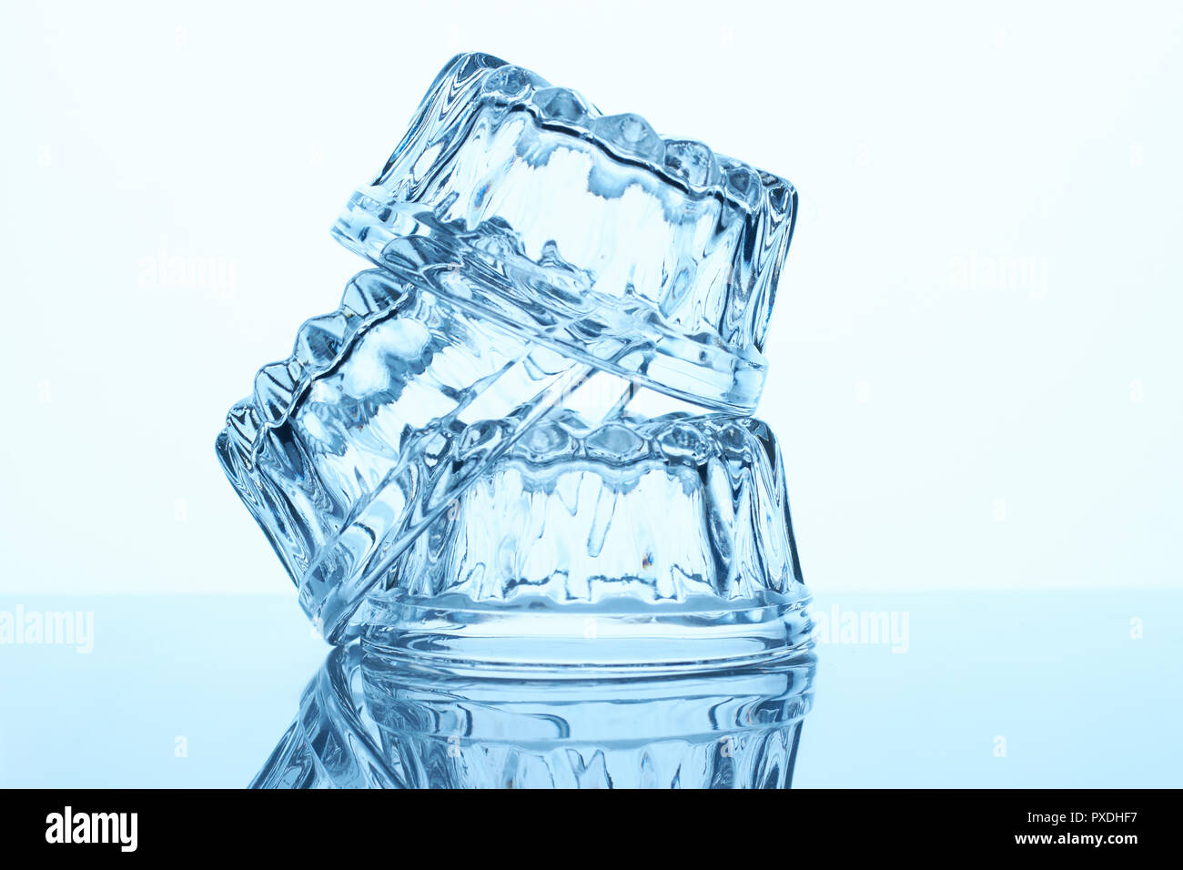 Three little glass cups Stock Photo - Alamy