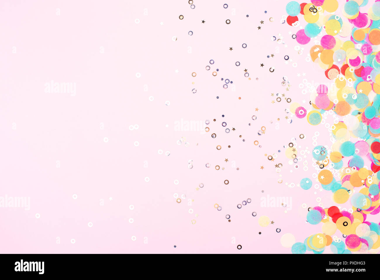Festive pink background with colorful confetti and sparkles Stock Photo ...