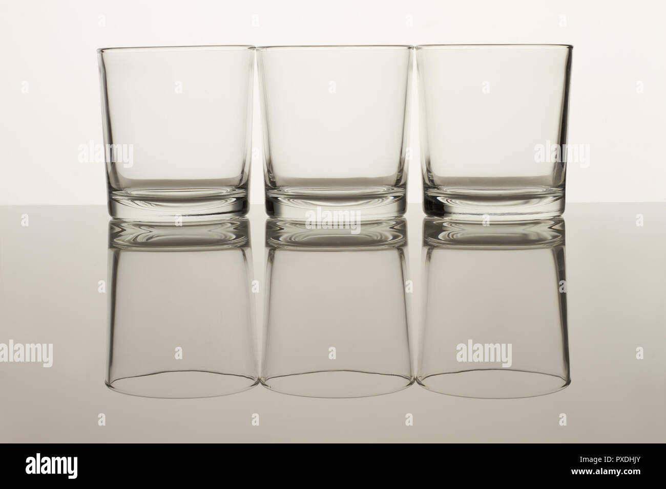Three empty glass cups Stock Photo - Alamy