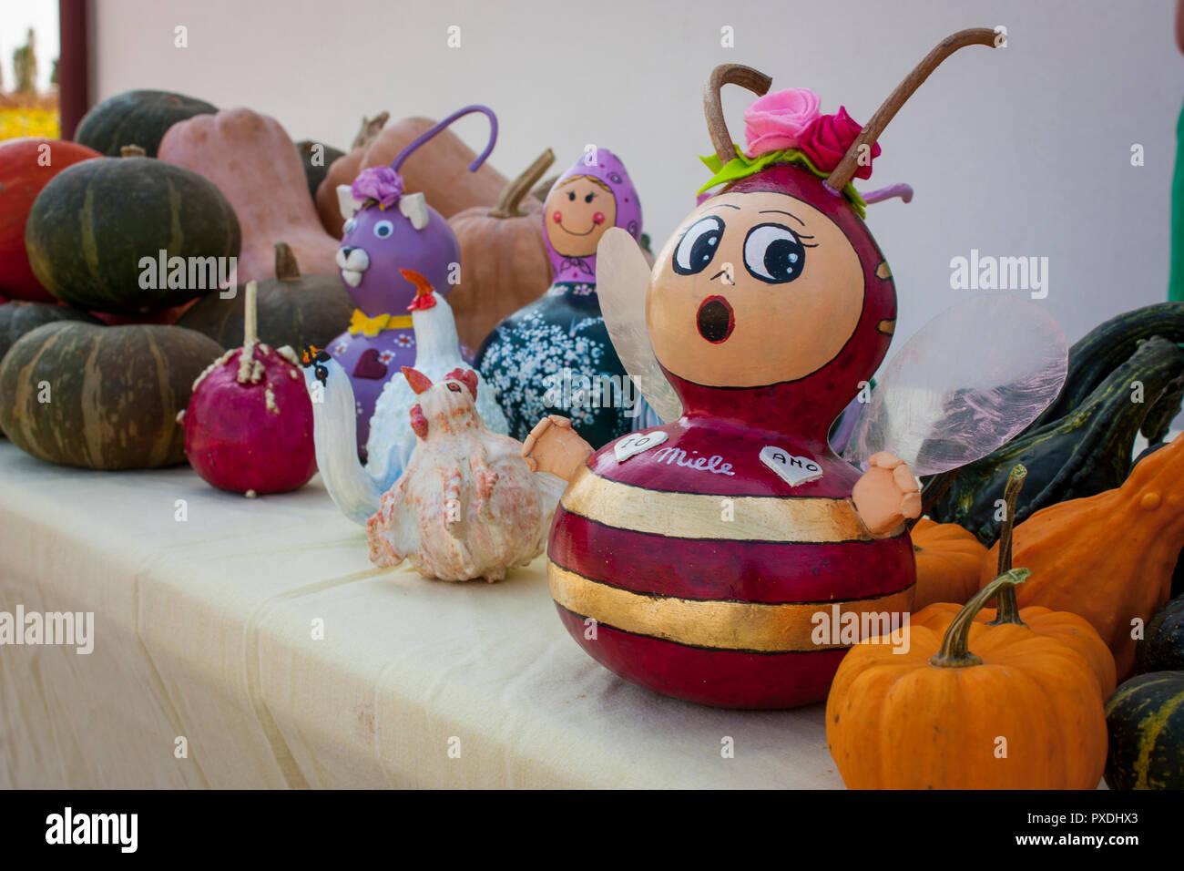 Stall at a marketplace containing small handicraft sculptures in the ...
