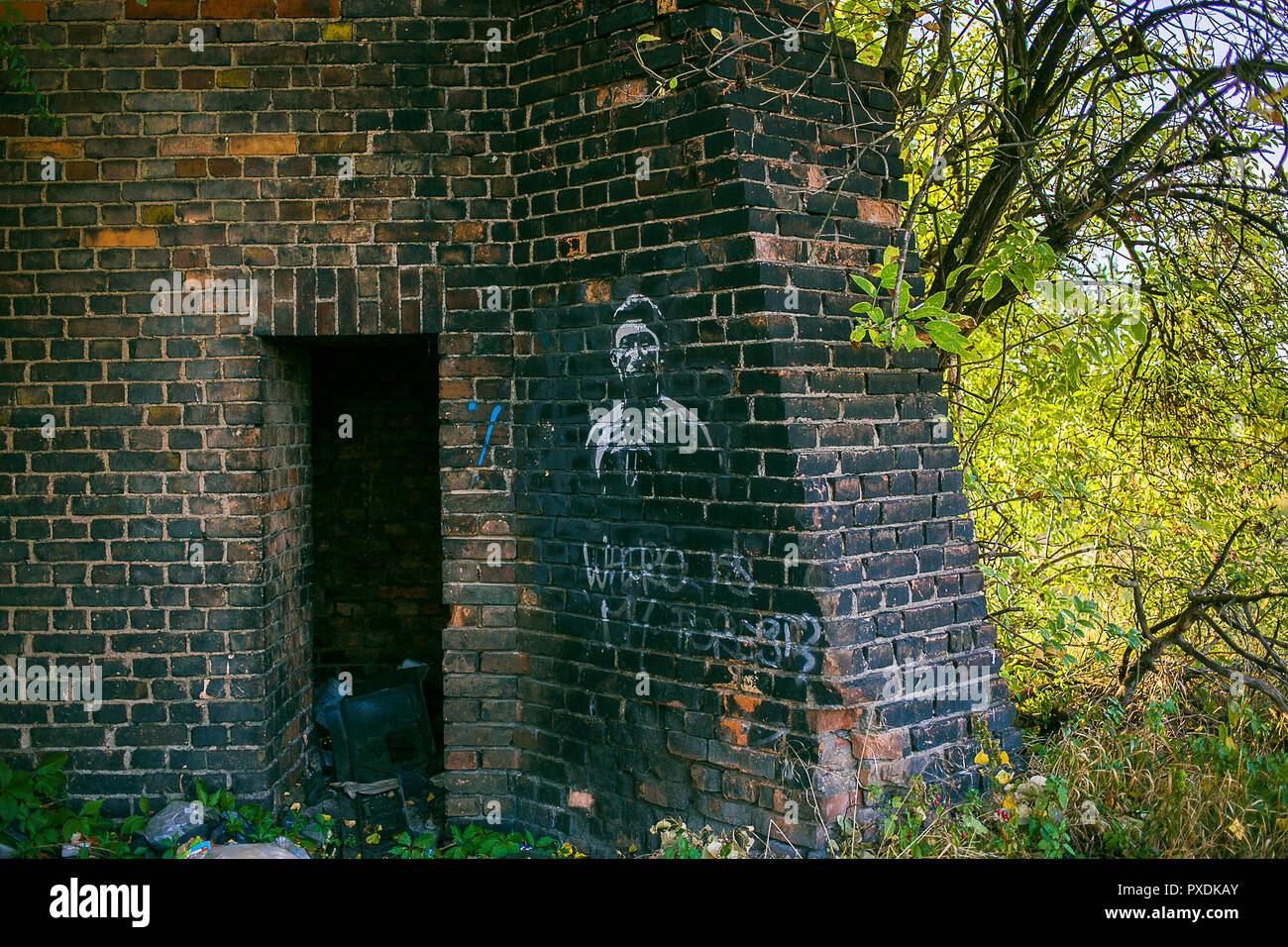 Abandoned brick bunker building with an interesting graffiti by the ...