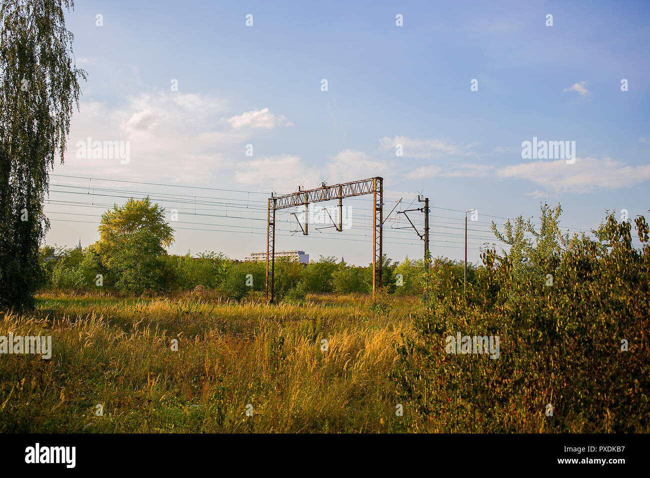 Electric towers over train tracks in Greater Poland on the warm sunny ...