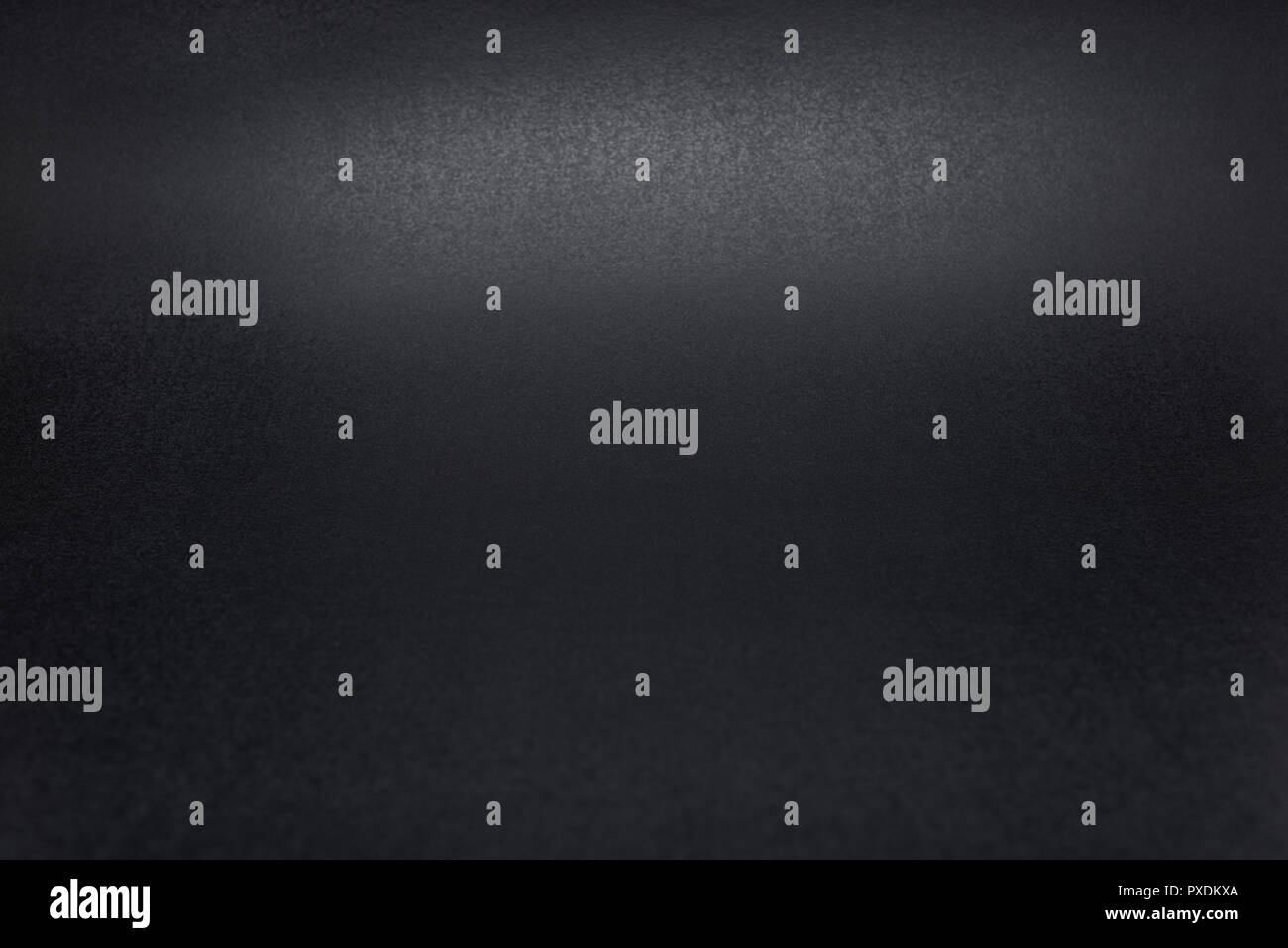 Black, rough textured background lit with dim light Stock Photo - Alamy