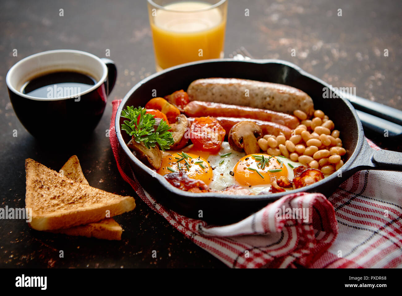 Full English breakfast on dark rusty background Stock Photo - Alamy