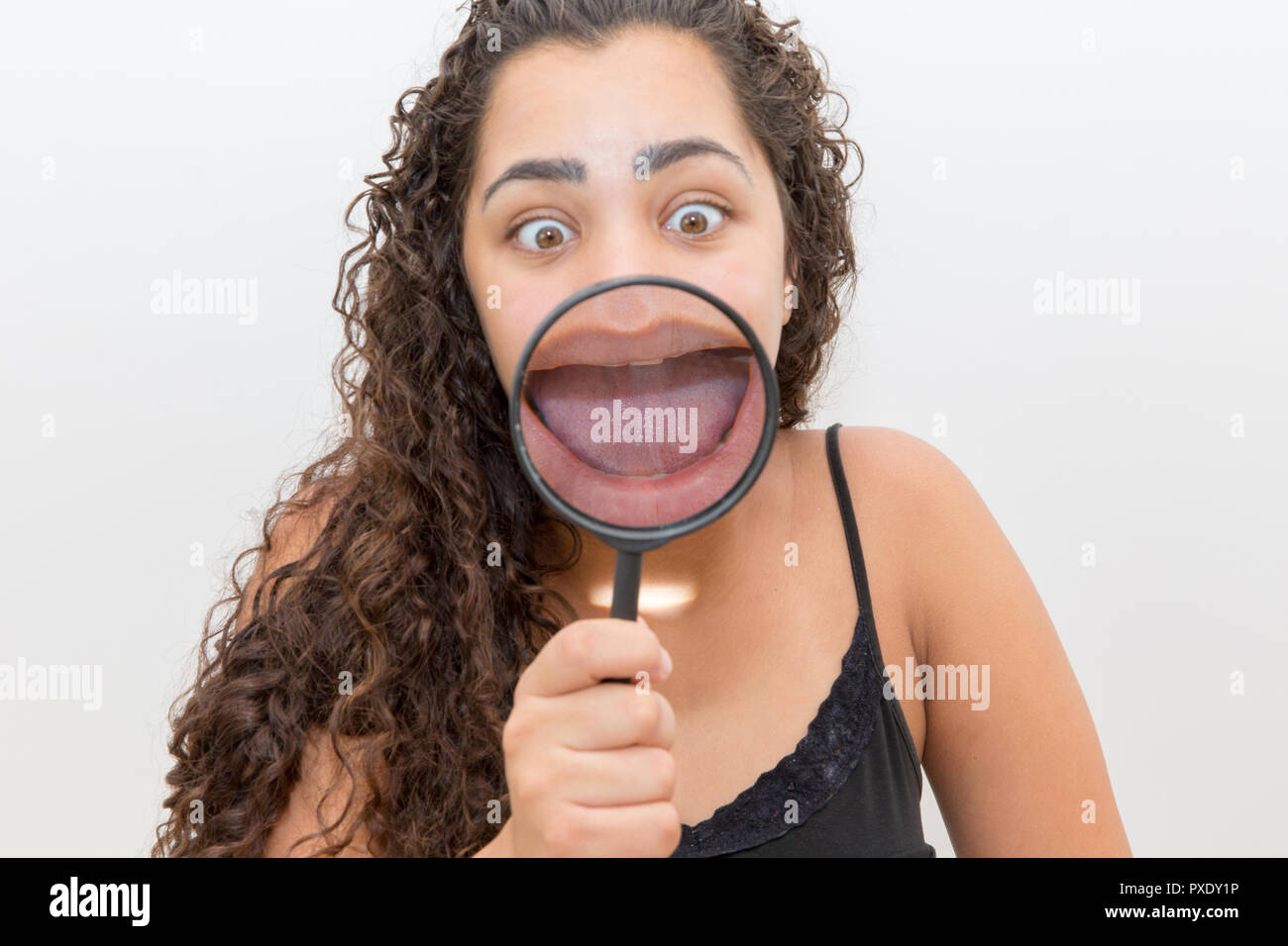 Magnifying glass young female hi-res stock photography and images - Alamy