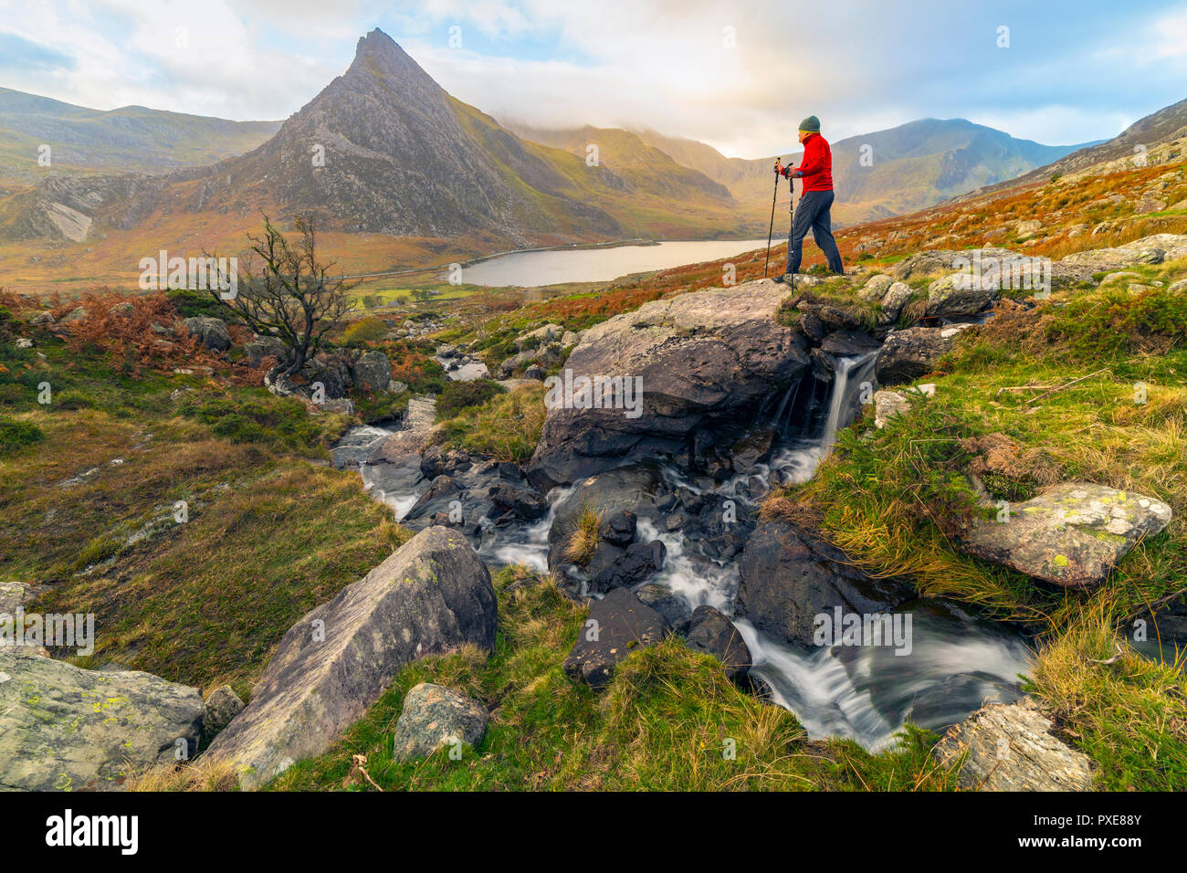 A mountain walker taking in the beautiful landscape of the Ogwen Valley ...