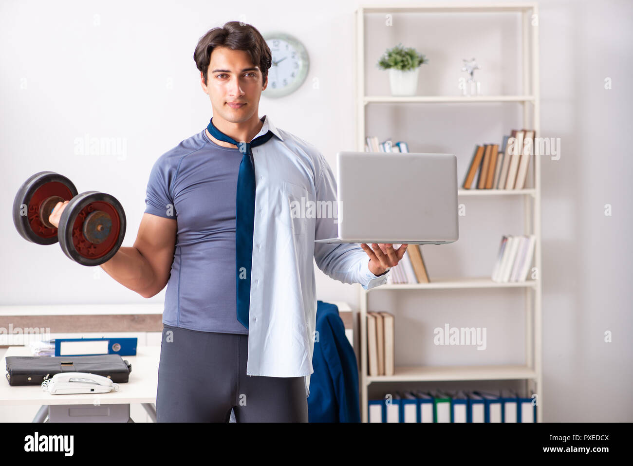 Employee combining work and healthy lifestyle Stock Photo - Alamy
