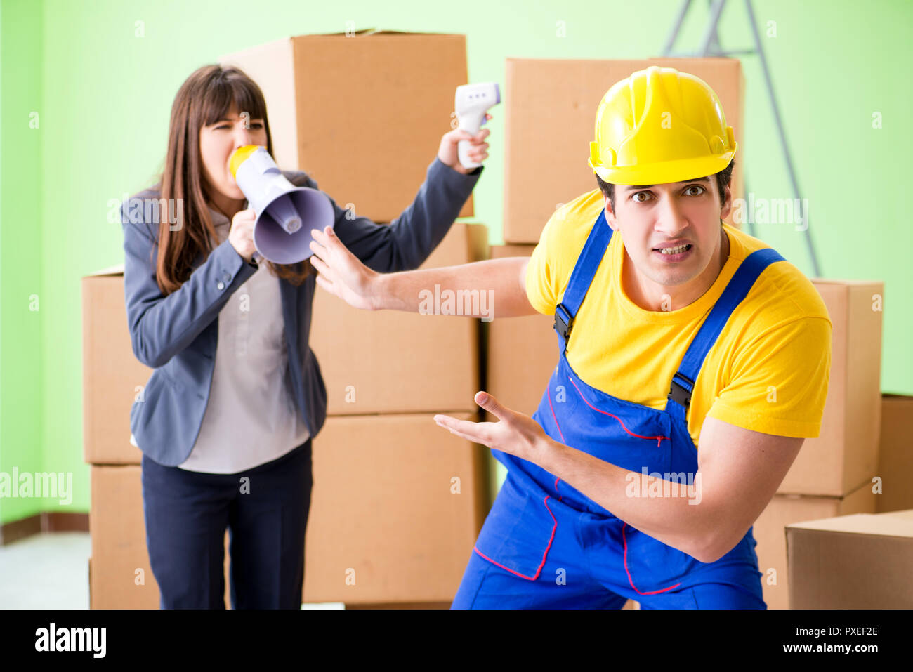 Woman boss and man contractor working with boxes delivery Stock Photo ...