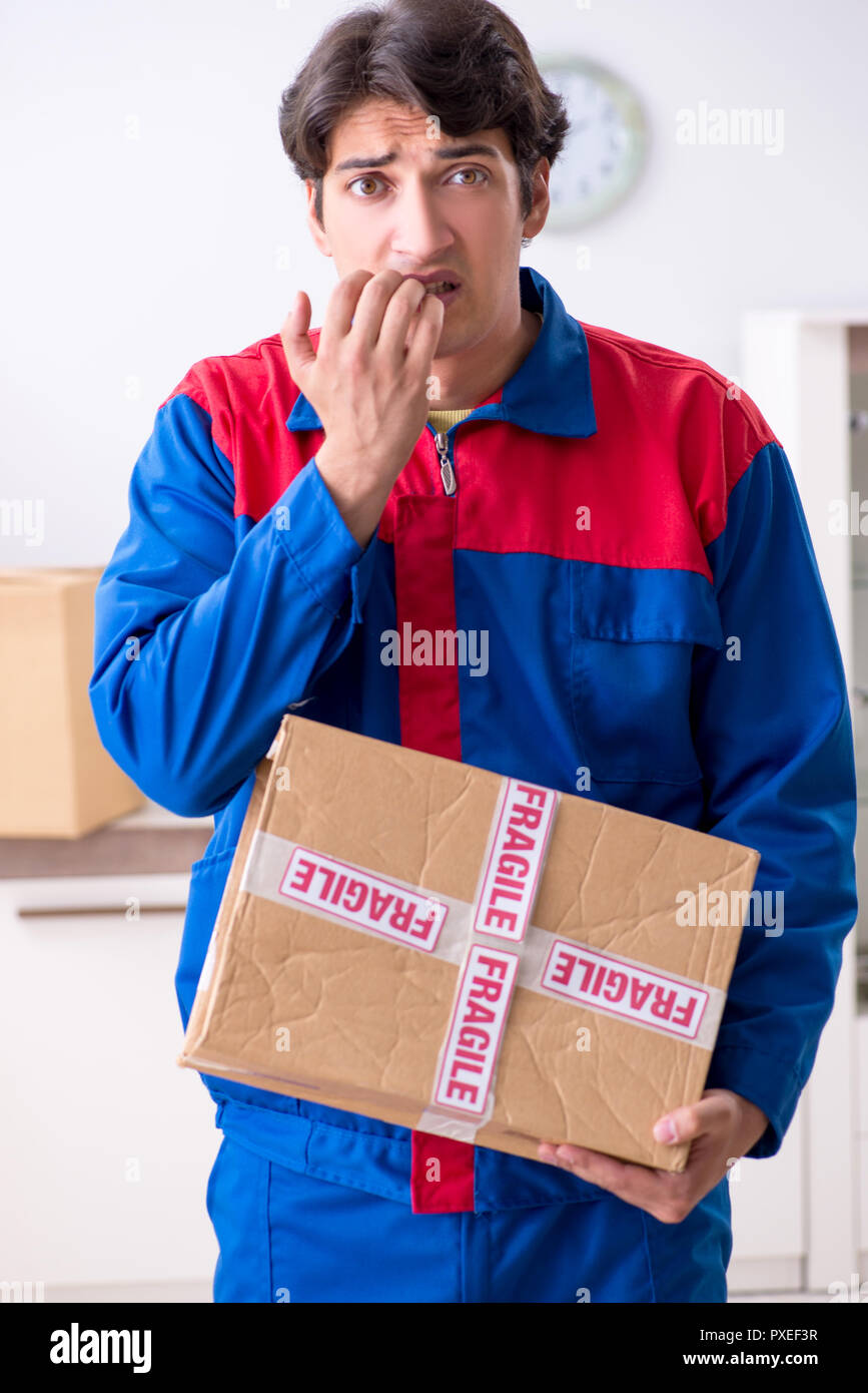 Transportation contractor with fragile boxes Stock Photo - Alamy