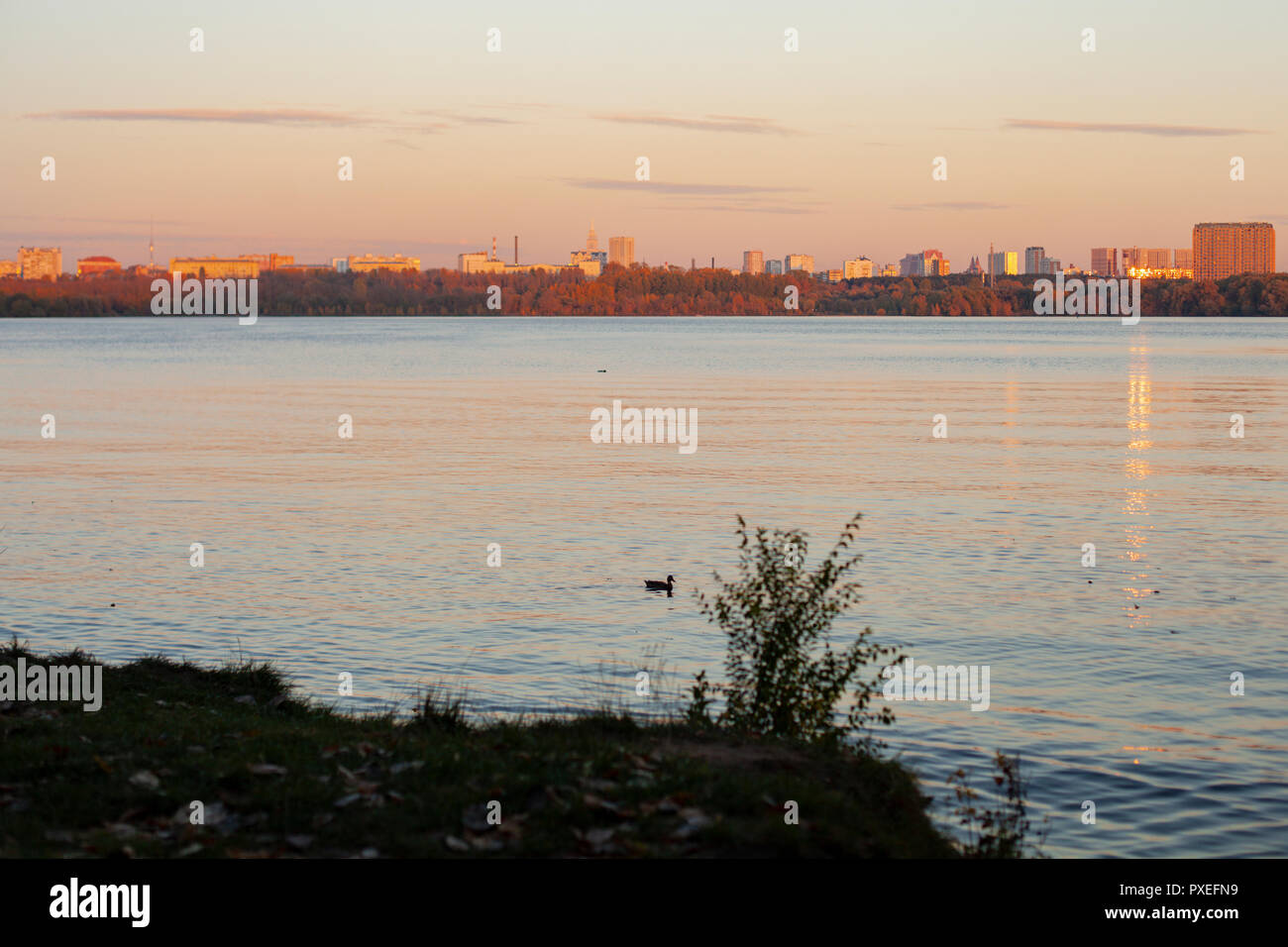 cityscape at dusk, sunset over the river Stock Photo - Alamy