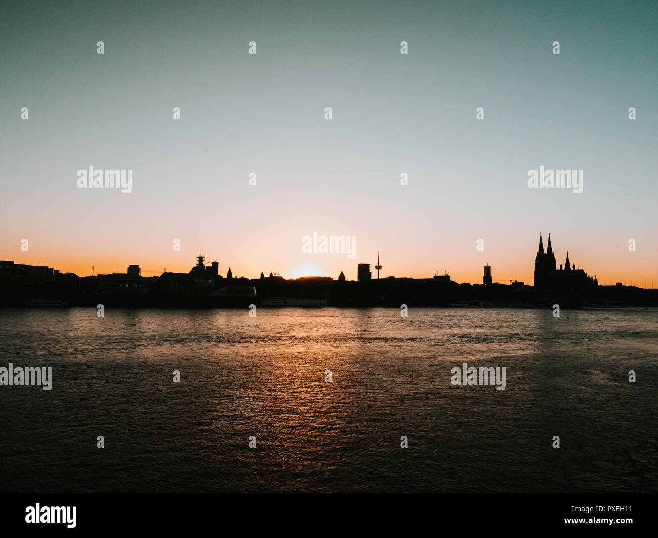 Cityscape of Cologne, Germany, at sunset. Cologne Cathedral, old town ...