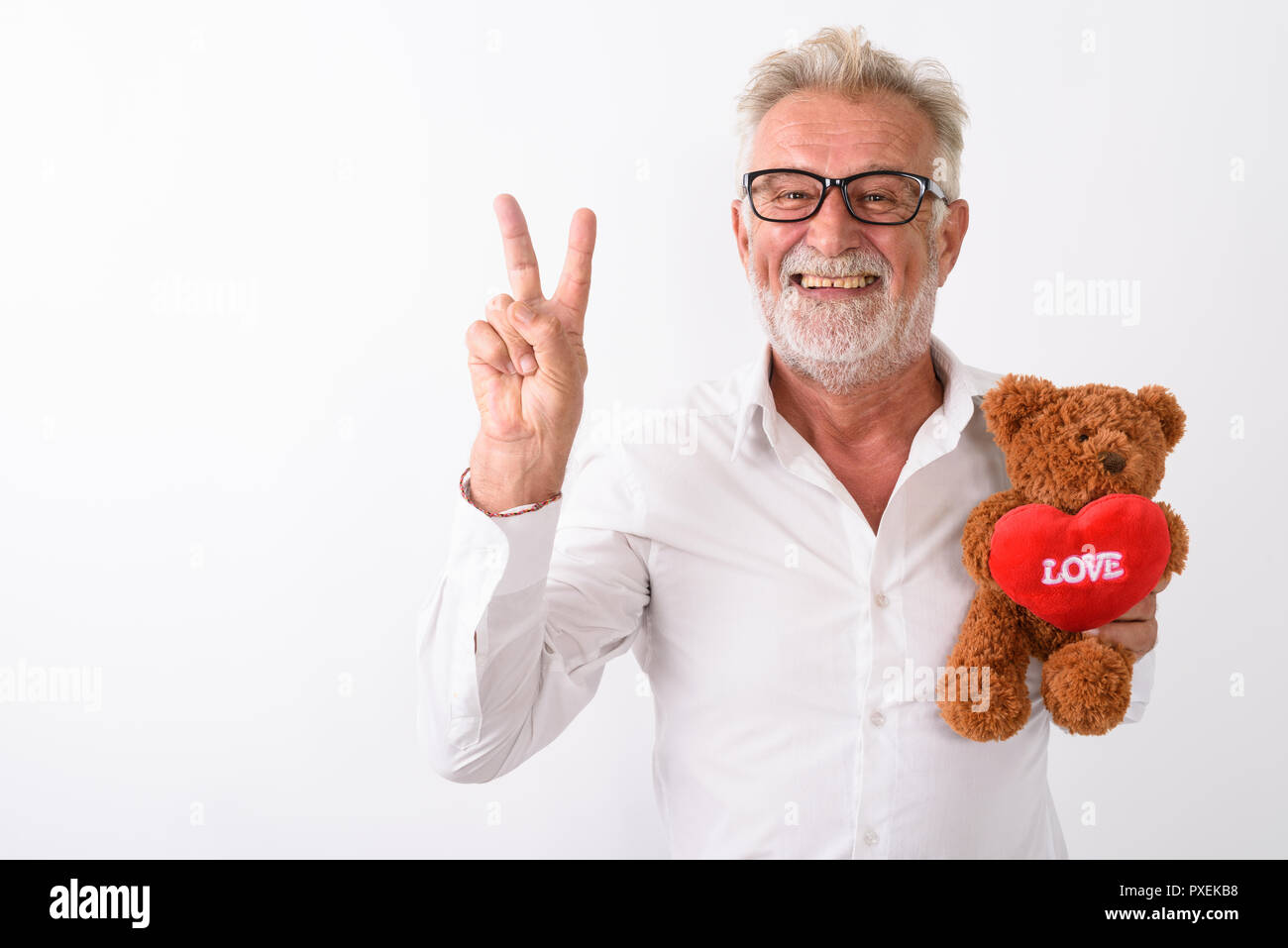 Giving peace sign and smiling hi-res stock photography and images - Alamy