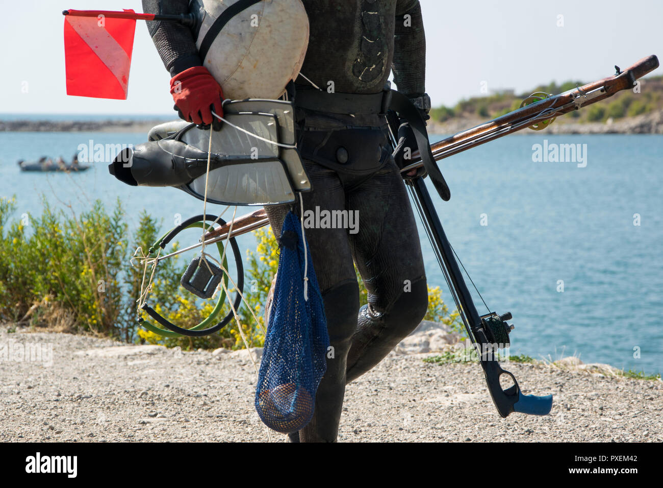 Diver speargun walking on beach hi-res stock photography and images - Alamy