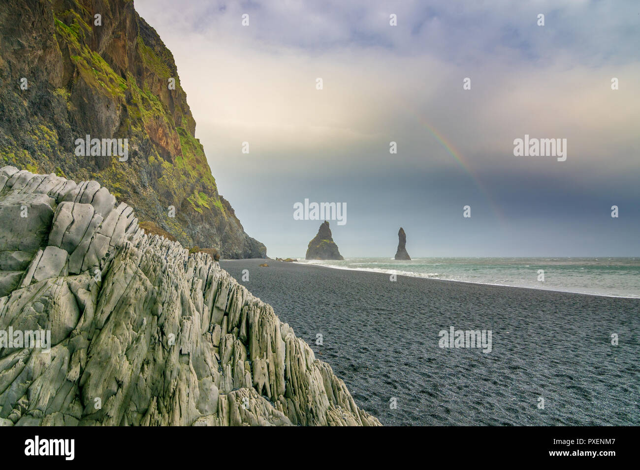 Reynisfjara black sand beach with amazing columnar basalt formations, a ...