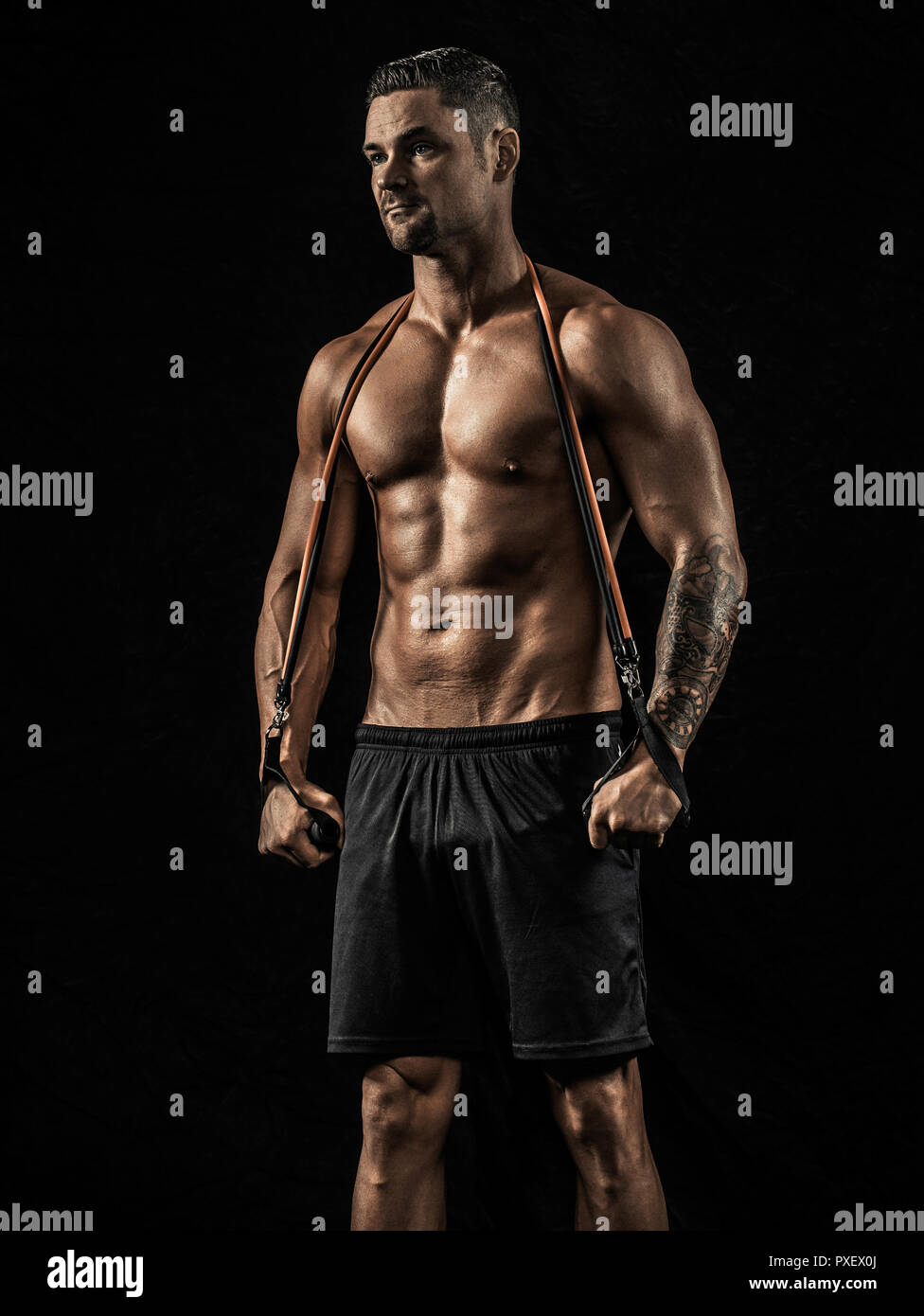 Toned and muscular male who regularly weight trains at the gym Stock ...