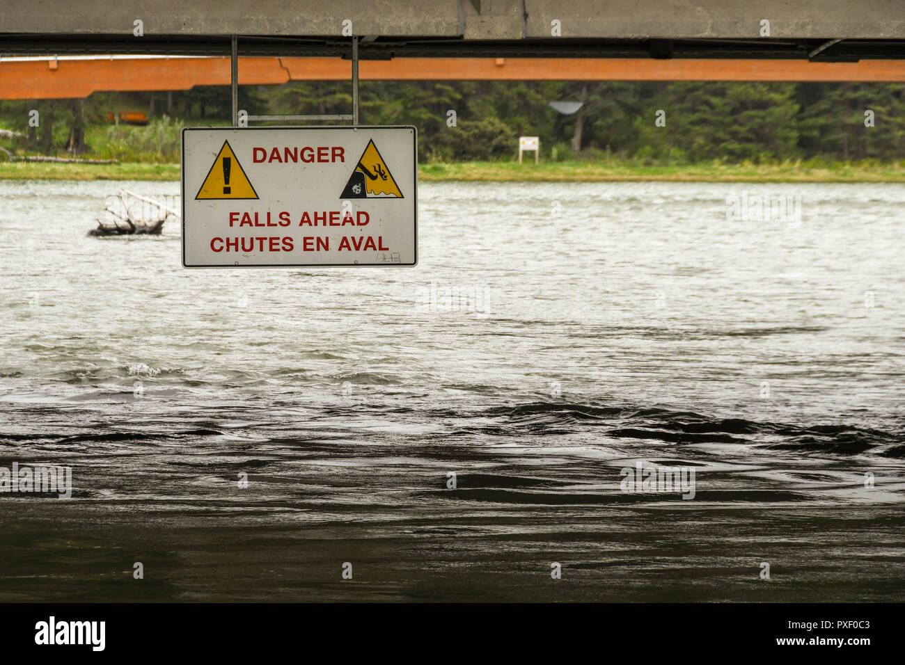 BANFF, AB, CANADA - JUNE 2018: Danger sign warning of waterfalls ahead ...