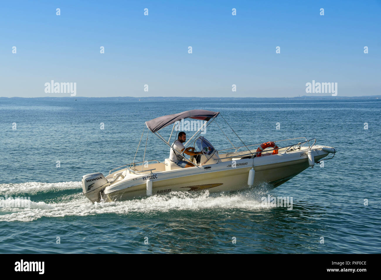 Man driving speedboat hi-res stock photography and images - Alamy
