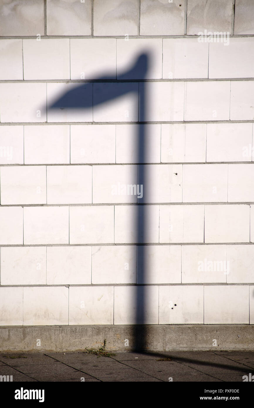A distinctively Lantern shadow on a brick wall Stock Photo - Alamy