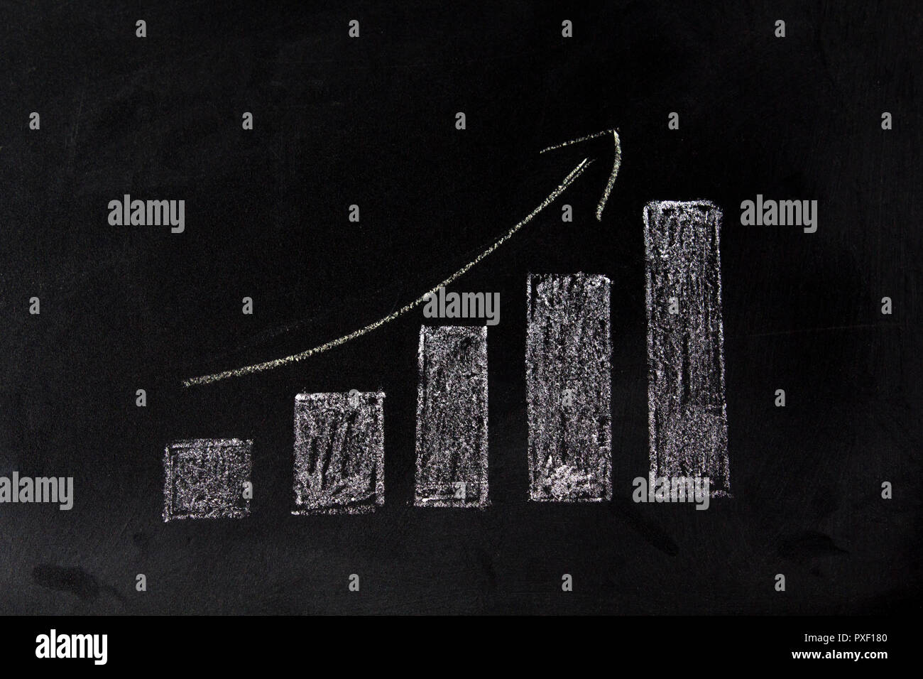 Growing graph on chalkboard. Sales growth concept Stock Photo - Alamy