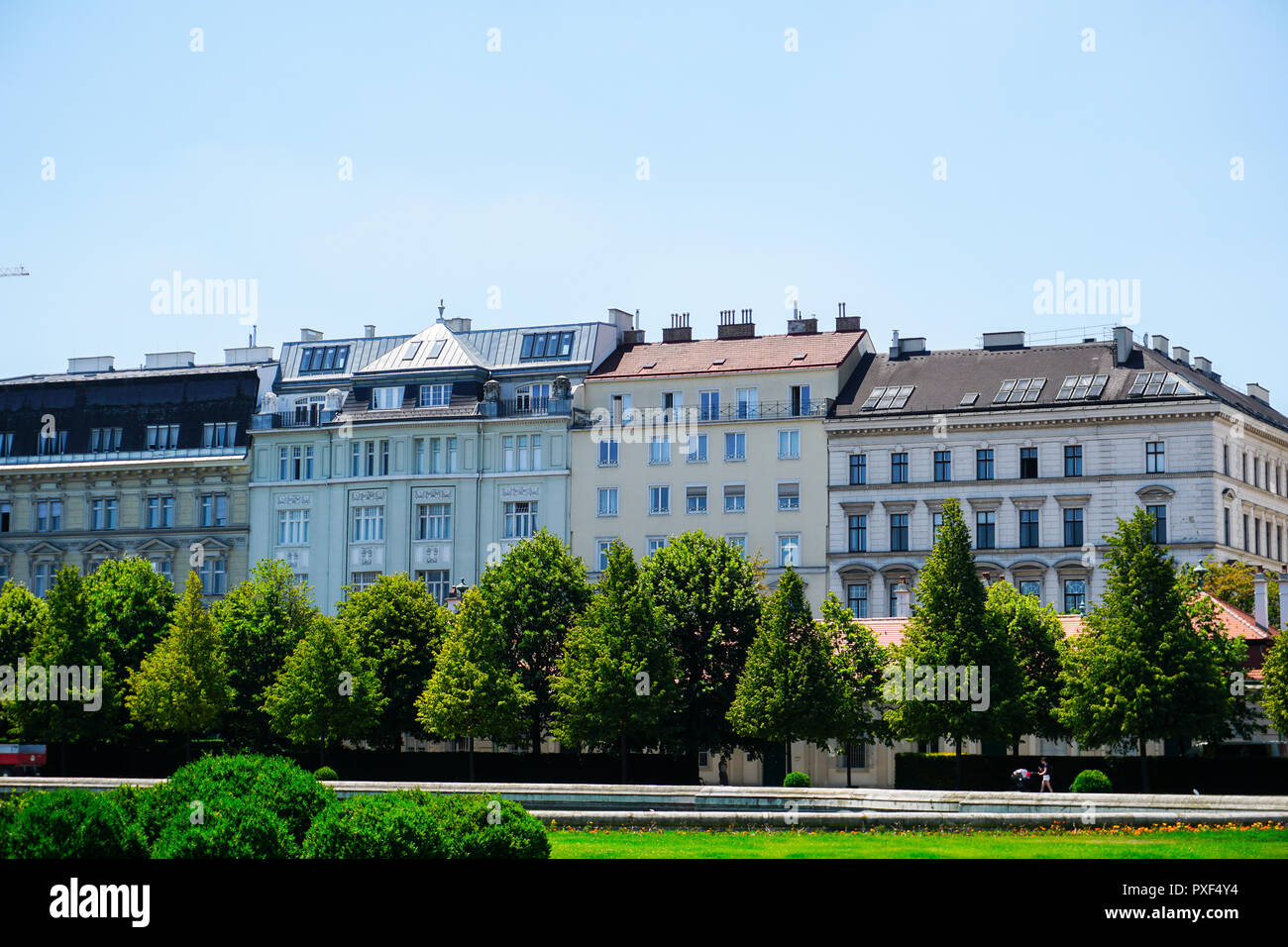 Beautiful buildings and landscape design with trees and lawn in Vienna ...