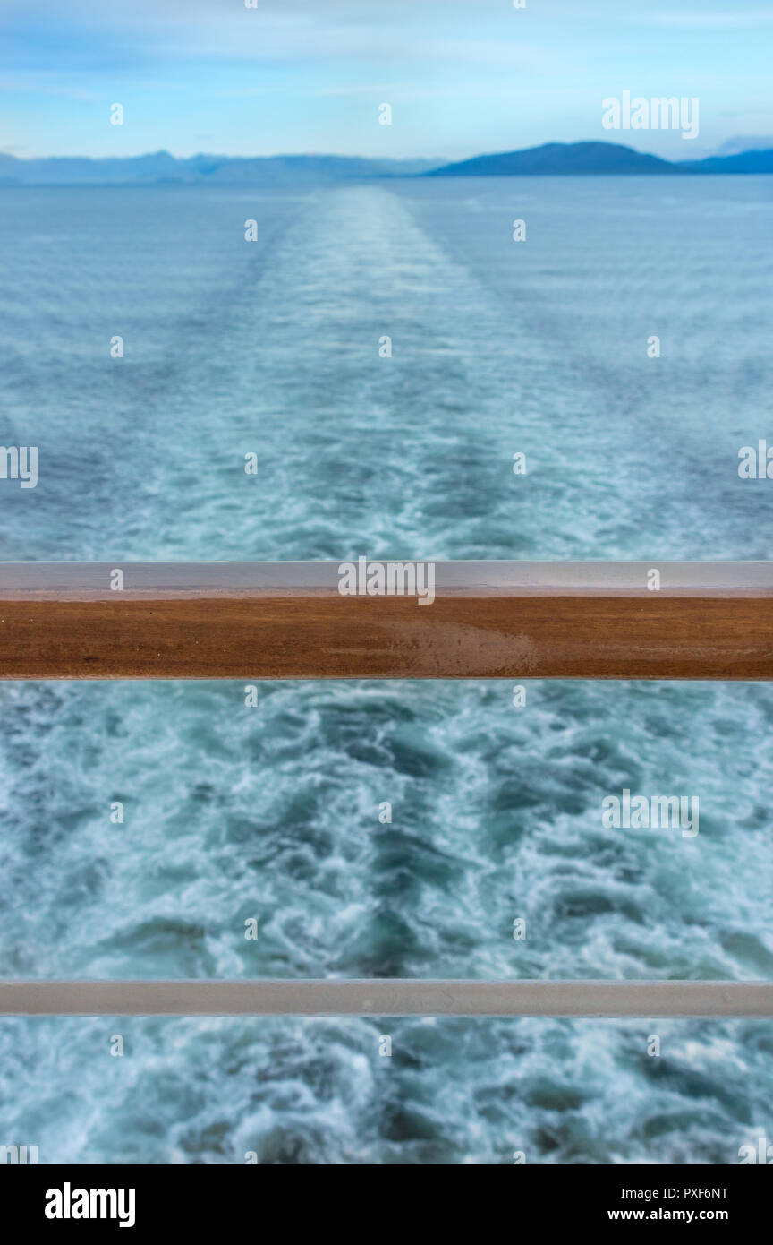 Straight line of ship's wake and stern railing. South facing view of ...