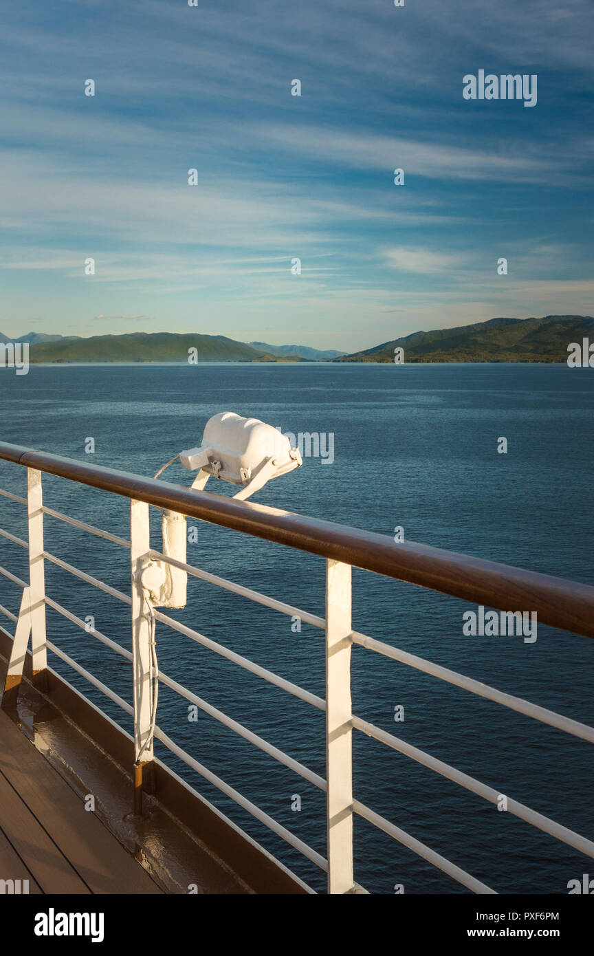 Exterior white metal light fixture and railing, port side on a cruise ...